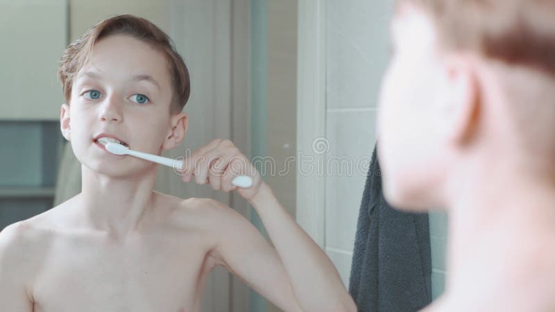 Brunette Boy Brushes His Teeth with Toothpaste and. daily Routines ...