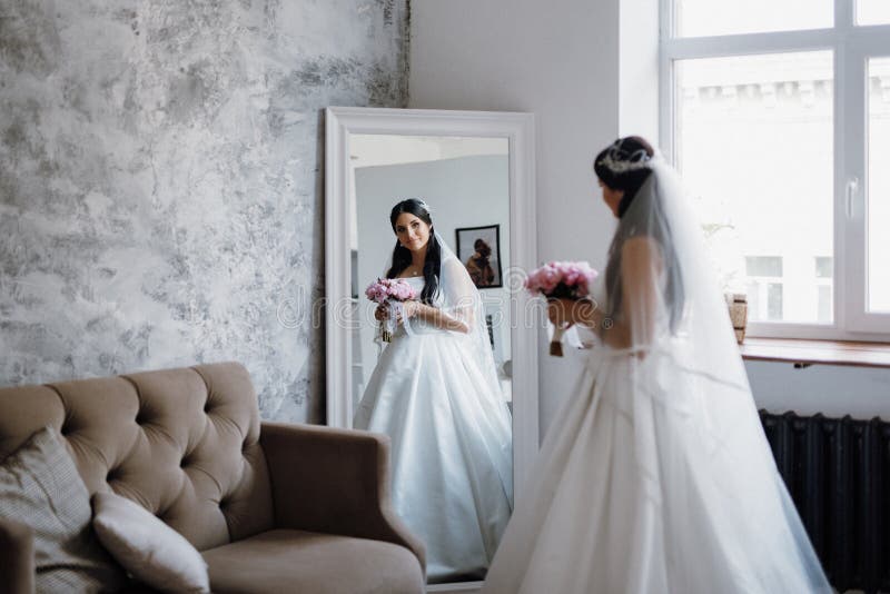 Brunette Bride in a Tight Wedding Dress in a Studio Stock Image - Image ...