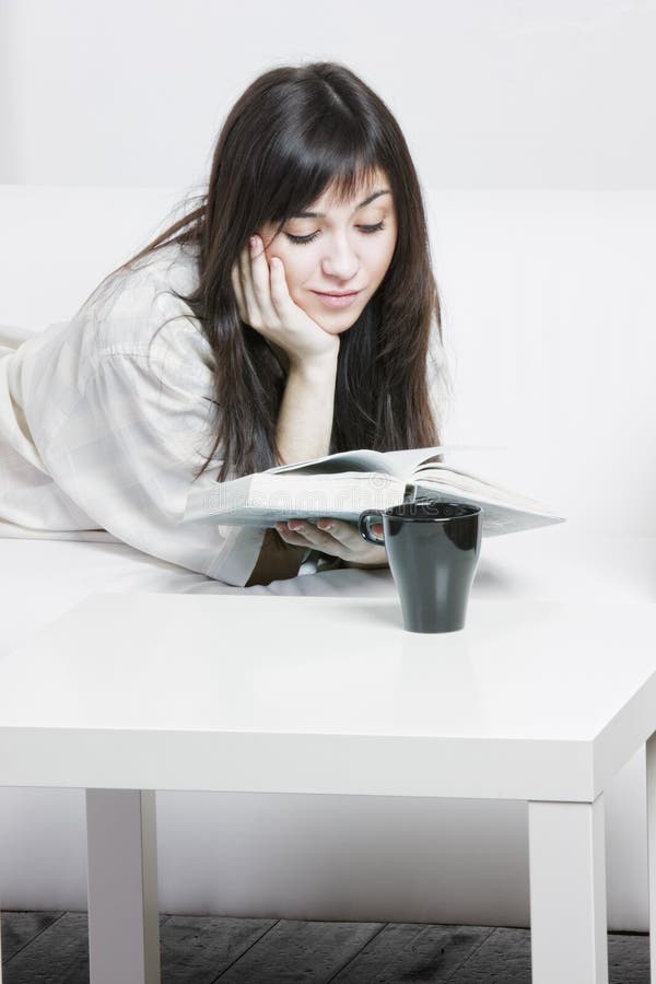 Brunette in Casual Reading on Couch Closeup Stock Image - Image of ...