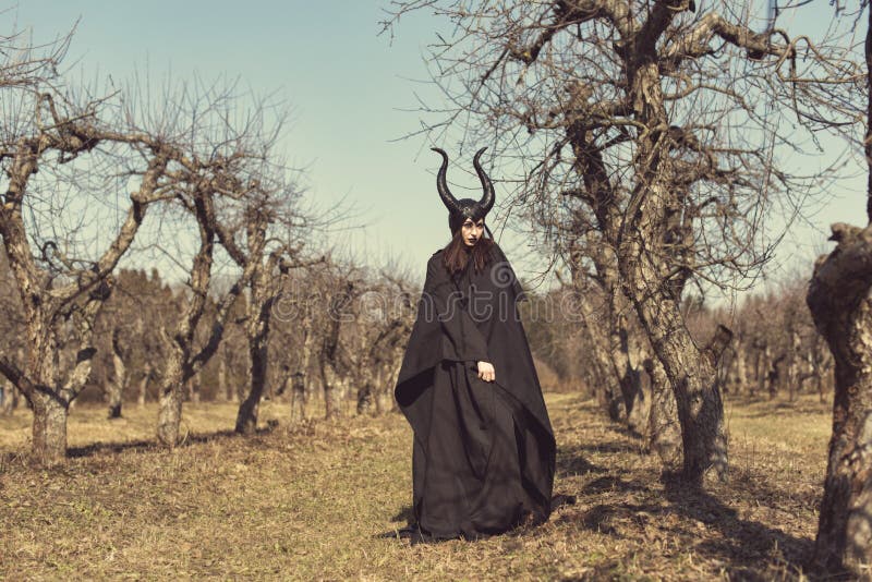 Brunette in a Spring Apple Orchard Stock Photo - Image of ghost, forest ...