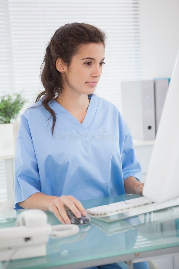 Brunette Doctor Using Mouse of Computer Stock Photo - Image of mouse ...