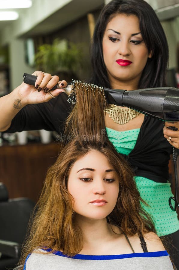 Brunette Facing Camera Getting Hair Done by Stock Image - Image of ...