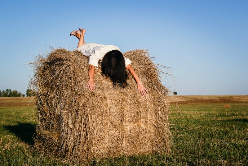 Brunette Girl Lying on a Haystack Stock Image - Image of dreaming ...
