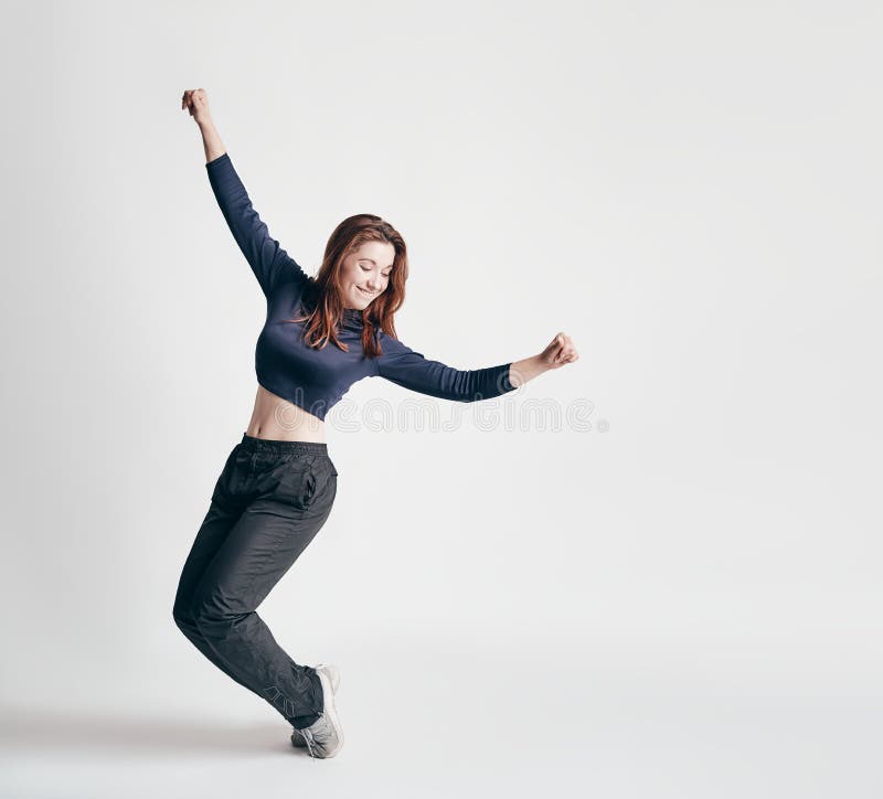 Brunette Girl Shows Dance Elements on a White Background Stock Photo ...