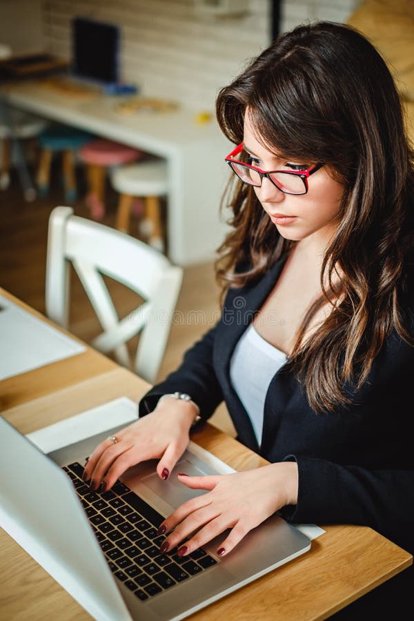 Girl Typing on Computer in Restaurant Stock Photo - Image of ...