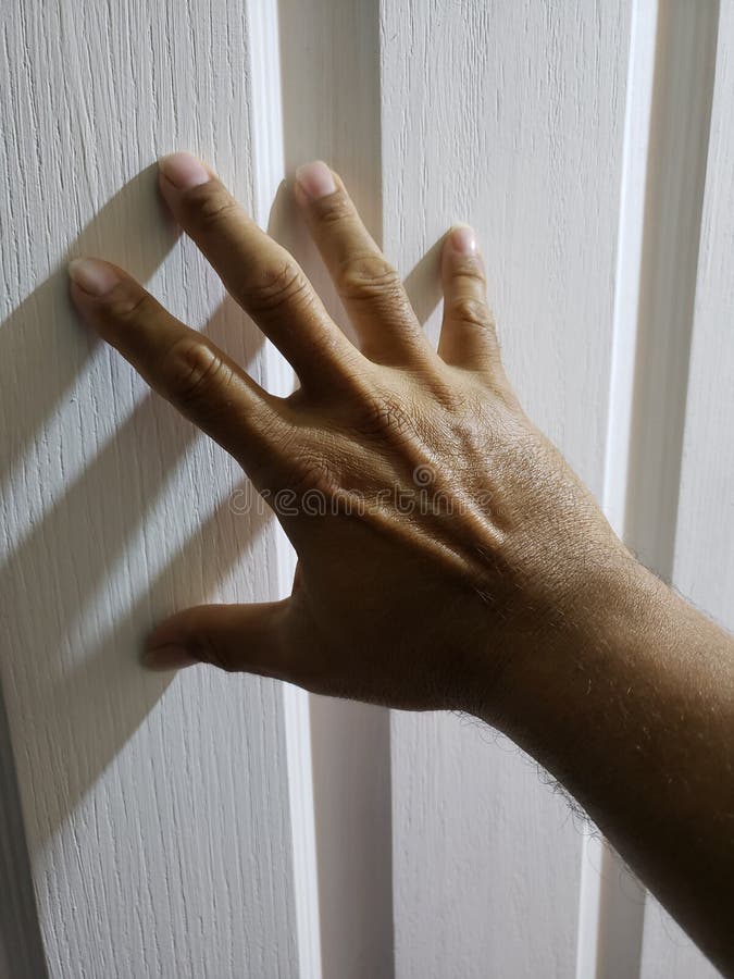 Brunette Hand on White Wooden Door Stock Photo - Image of white, wooden ...