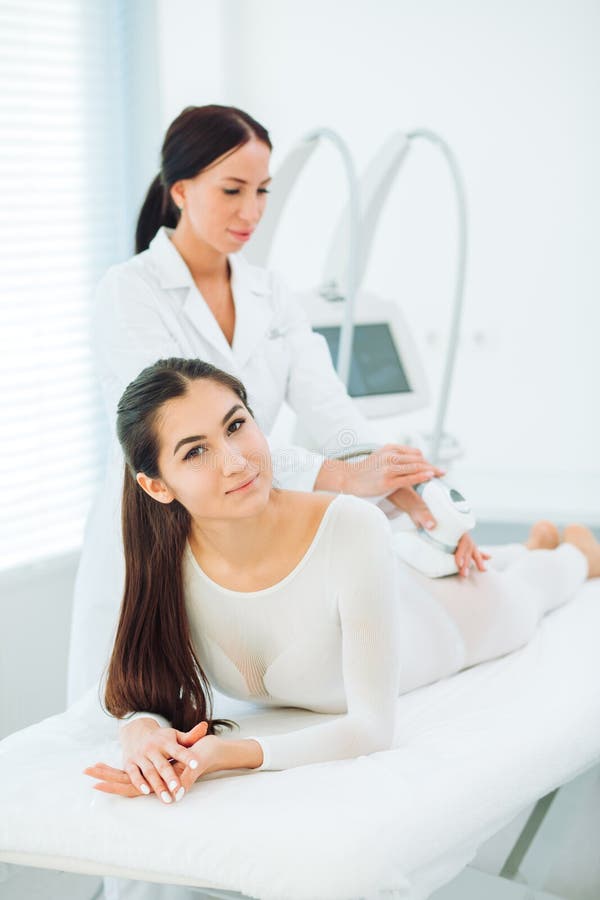 Brunette Happy Woman Enjoying Lpg Massage At The Beauty Parlour Stock