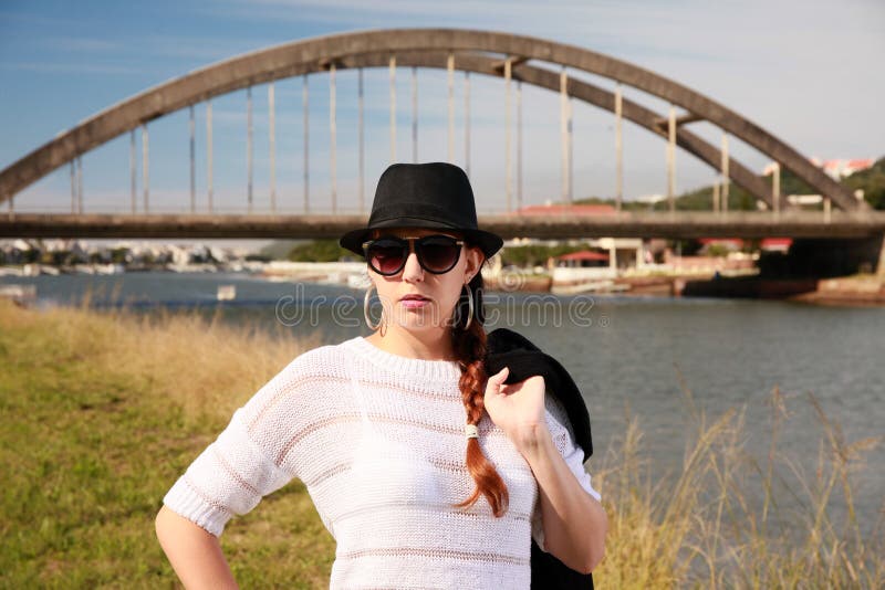 Brunette Lady is Posing in Front of the Port ALfred Arch Bridge Stock ...