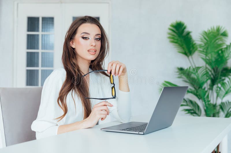 Beautiful Brunette with Laptop Communication Online Remote Work Stock ...