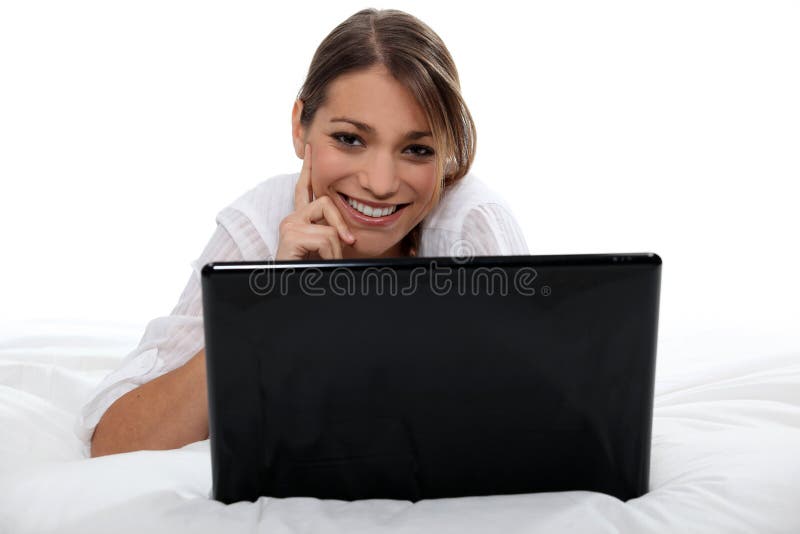 Brunette with laptop stock photo. Image of bedroom, cheerful - 37039236