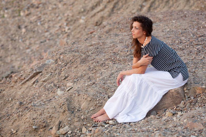 Beautiful Woman Sitting on Stone Stock Image - Image of cool, beach ...