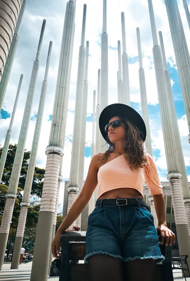 Brunette Woman with Black Hat Posing in Square Stock Photo - Image of ...