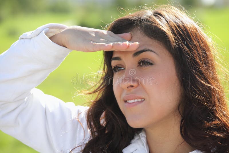 Brunette Looking Up from Under Hand Peak Stock Photo - Image of eyes ...