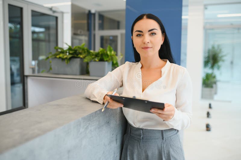 Brunette Woman Receptionist Working in Reception of the Beauty Salon ...