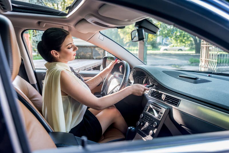 Brunette Woman Starting Engine in Car with Key Stock Image - Image of ...