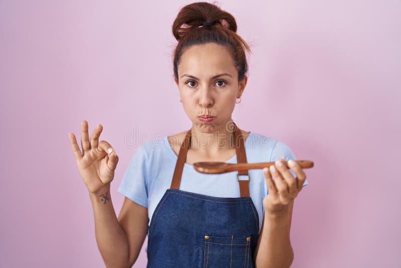 Brunette Woman Wearing Professional Cook Apron Holding Wooden Spoon ... Brunette Woman Wearing Professional Cook Apron Holding Wooden Spoon ...