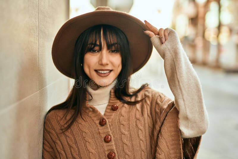 Brunette Woman Wearing Winter Hat Smiling Leaning on the Wall Stock ...