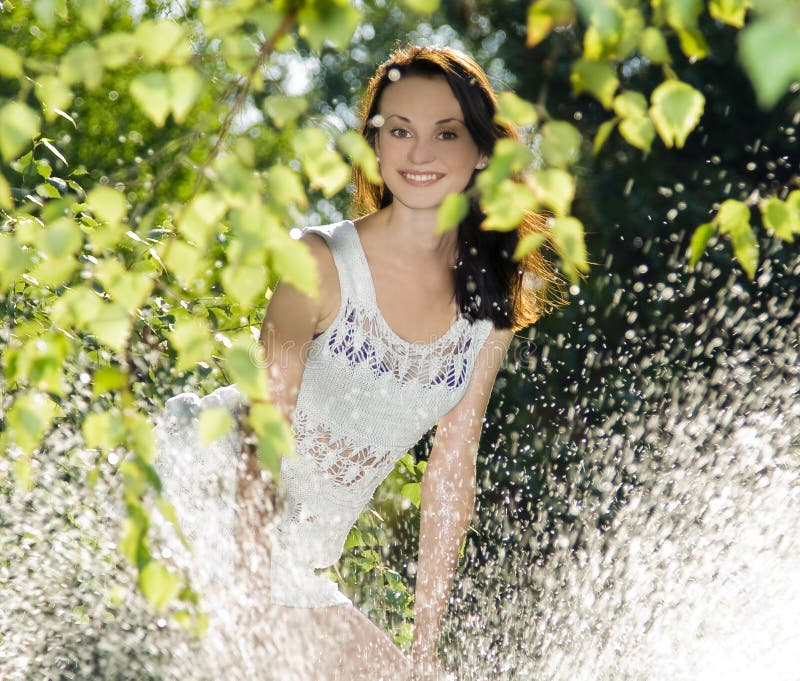 Brunettestanding Behind Water Splash Stock Photo - Image of happy ...