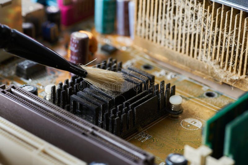 Brush Cleaning an Old Computer Board from Dust and Dirt. Close-up ...