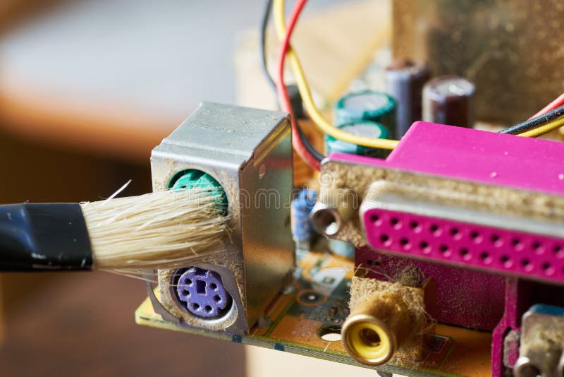 Brush Cleaning an Old Computer Board from Dust and Dirt. Close-up ...