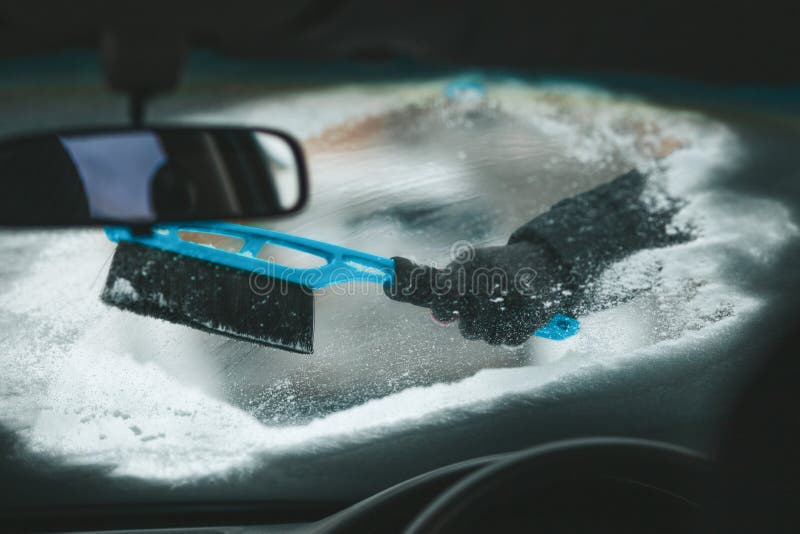 Brush Off Snow from the Windshield of the Car. Ice Storm Stock Photo ...