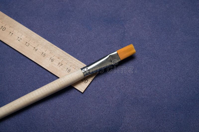 School Ruler with a Brush for Painting on a Blue Background Stock Image ...