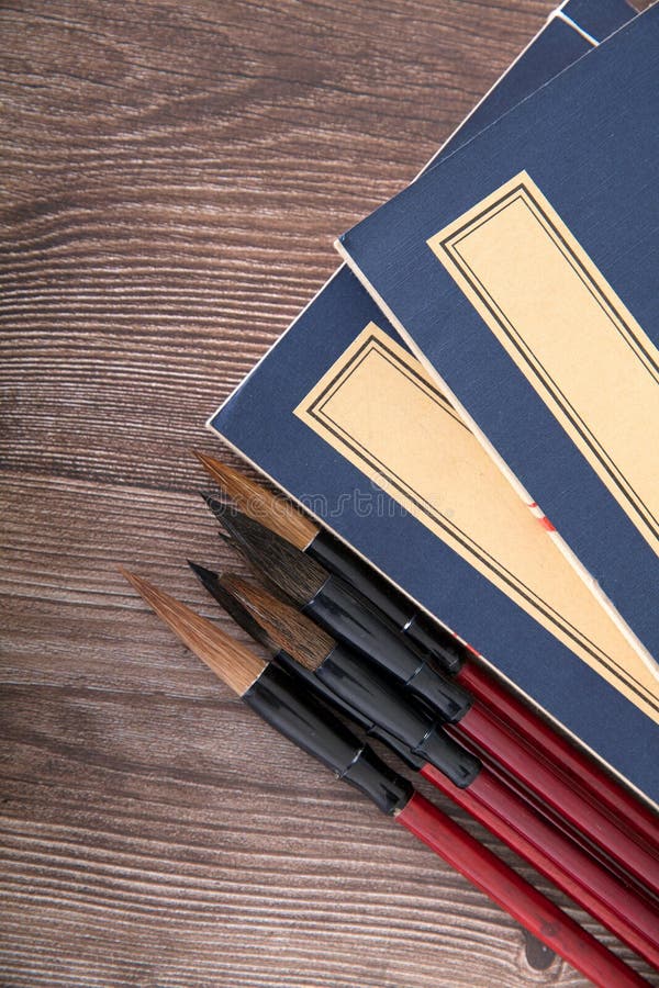 Brush and Thread Bound Books Stock Photo - Image of tool, book: 230960794