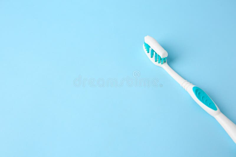 Brush with Toothpaste on Light Blue Background, Space for Text Stock ...