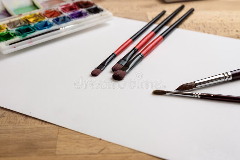 Brush and a white sheet stock image. Image of paper - 196102067