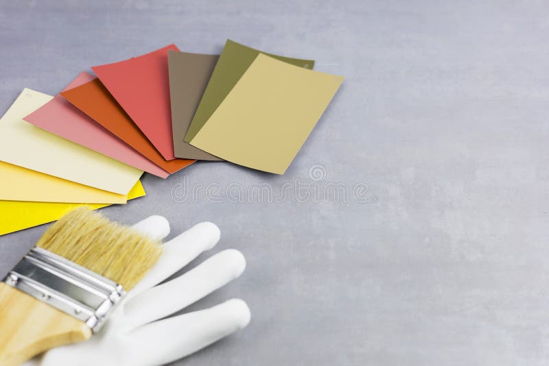 A Brush with a Wooden Handle and Paint Samples on a Gray Background ...