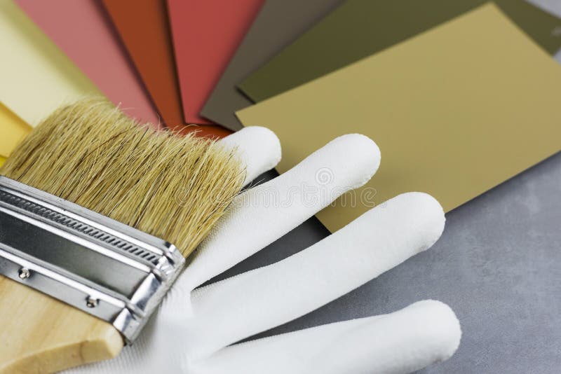 A Brush with a Wooden Handle and Paint Samples on a Gray Background ...