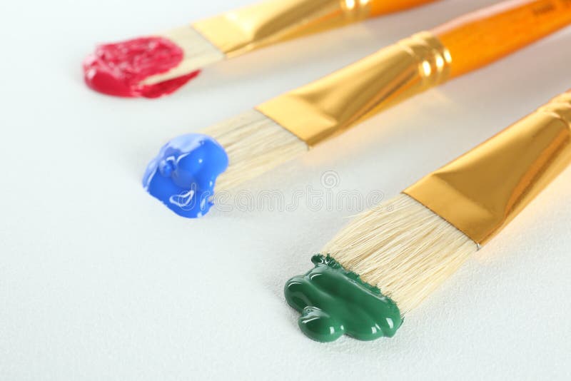 Brushes with Bright Paints on White Background, Closeup Stock Image ...