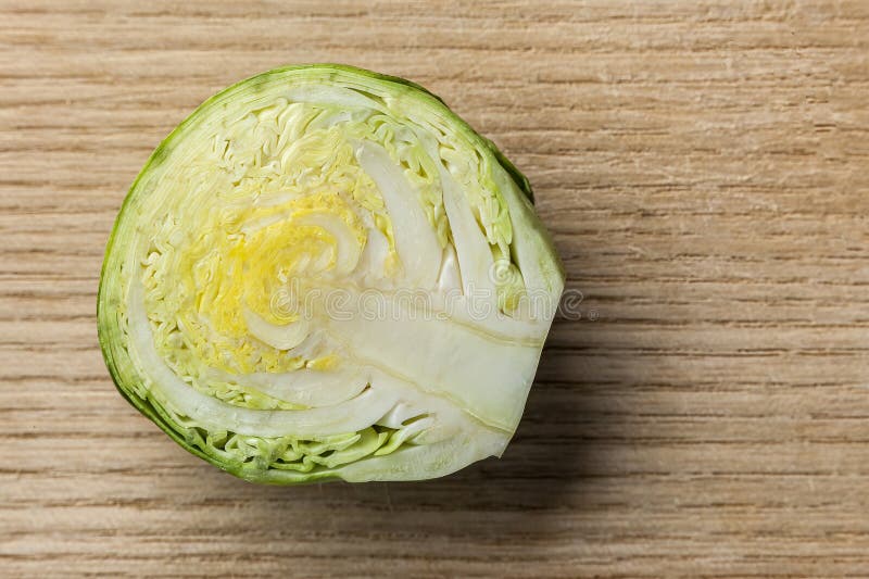 Brussels Sprout Section Cut in Half on a Wooden Cutting Board Stock ...