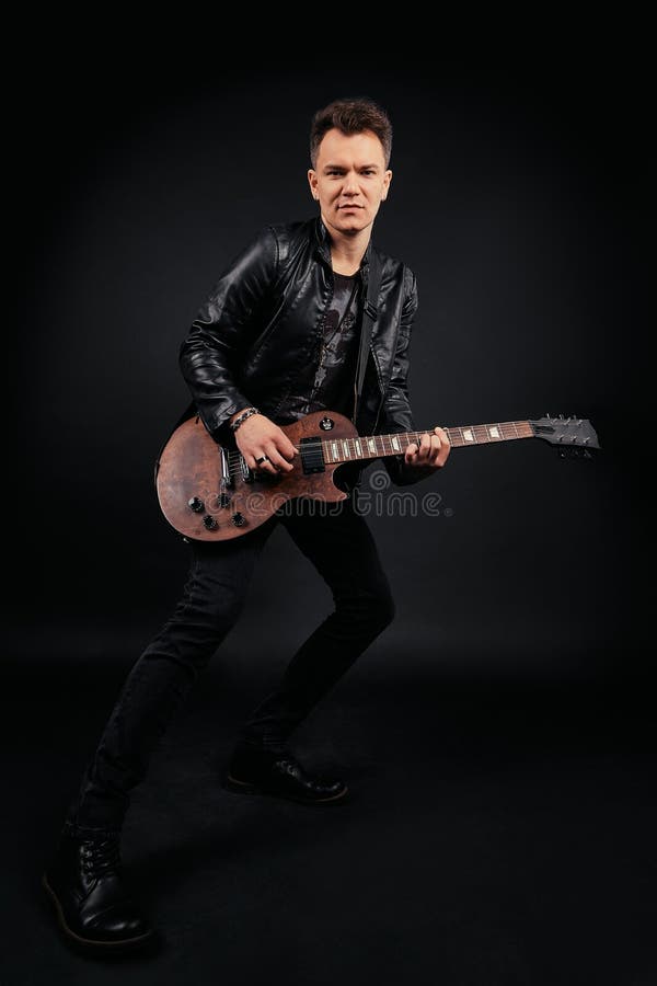 Brutal Rocker Playing Electro Guitar and Dancing Stock Image - Image of ...