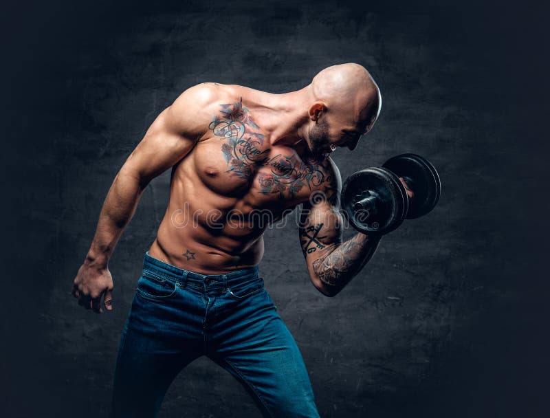 Shirtless Shaved Head Muscular Male With Tattoos On His Chest A Stock