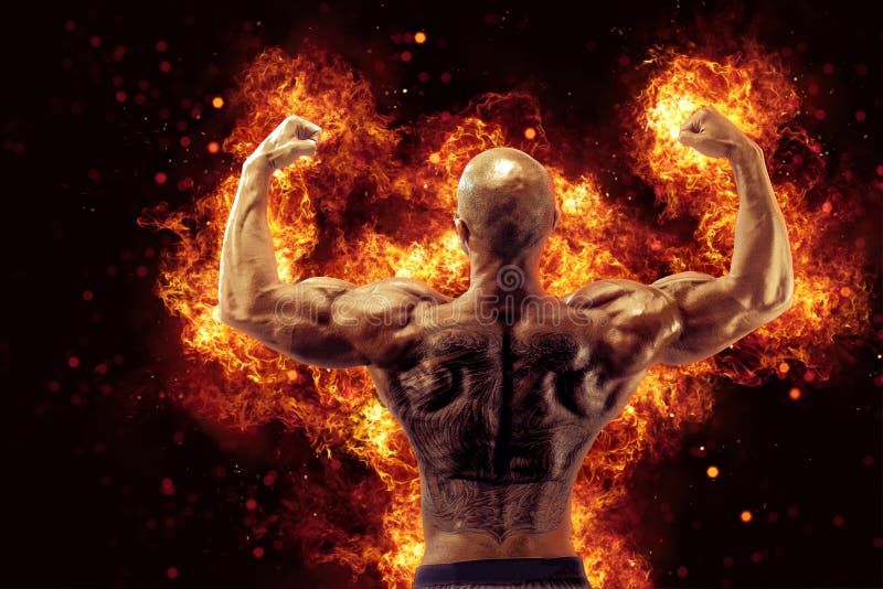 Brutal Strong Athletic Bodybuilder Posing. Fire and Spark Explosion in ...