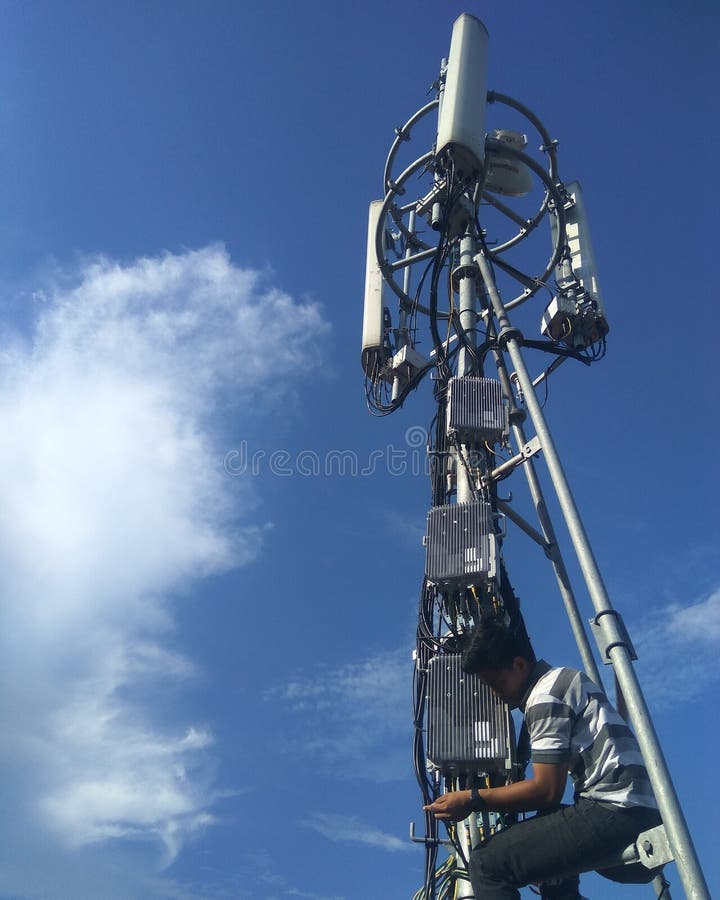 A BTS Tower Worker is Repairing a Broken Device Stock Photo - Image of ...
