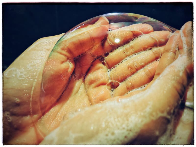 A bubble in hands stock image. Image of fingers, hands - 194348455