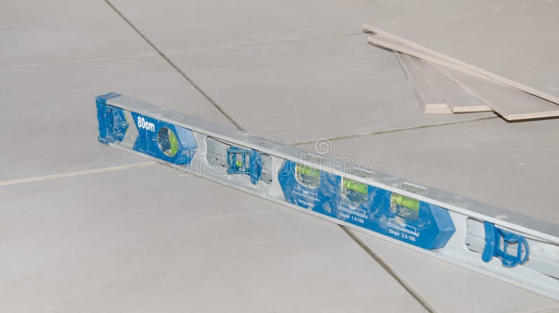 Bubble Level on a Floor Tiling Stock Photo - Image of measuring, work ...