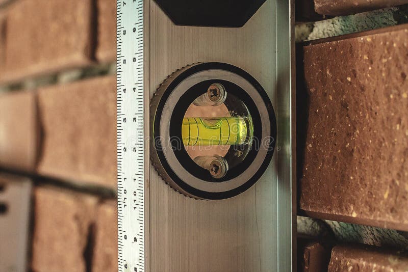 Bubble Level Laying Near of a Brick Wall. Construction Leveling Tool ...