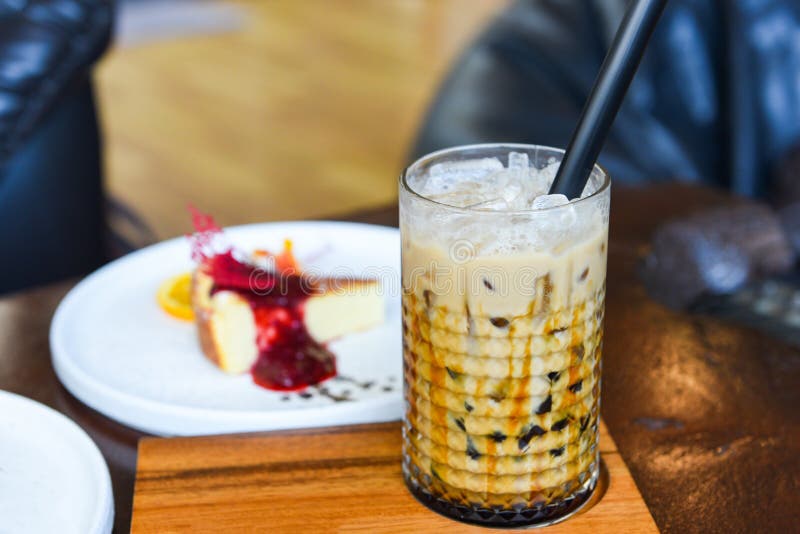 Bubble Milk Tea in Glass on the Wooden Table with Cake - Taiwan Milk ...