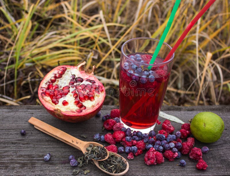 Bubble Tea with Pomegranate, Green Tea and Raspberry on a Wooden ...