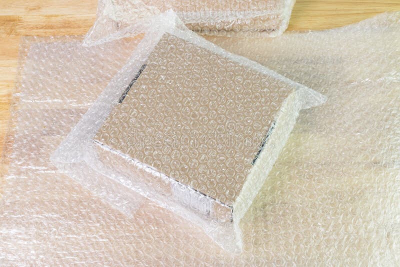 Bubbles Covering the Box by Bubble Wrap for Protection Product Stock ...