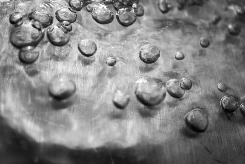Bubbles in Flowing Water on Metal Stock Photo - Image of black, motion ...