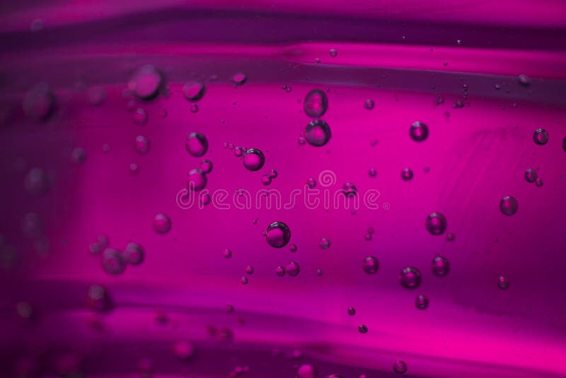 Bubbles in a Pink Oil Liquid Stock Photo - Image of beads, bubbles ...