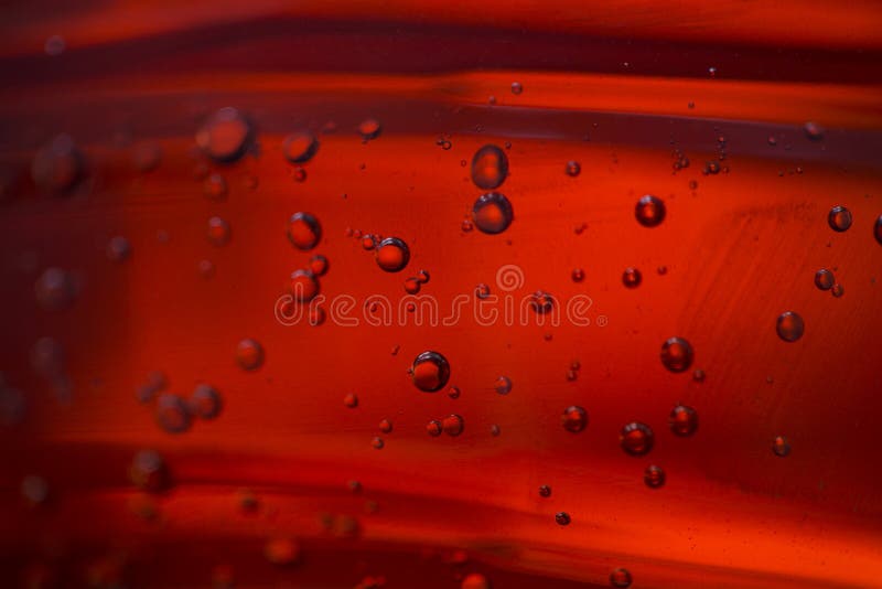 Bubbles in a Red Oil Liquid Stock Photo - Image of waterdrop, drops ...