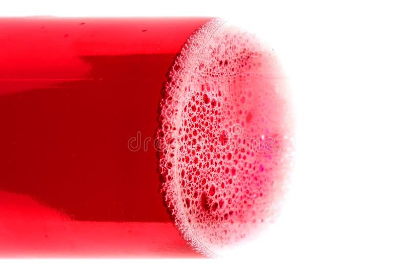 Bubbles on Surface of Congealed Red Liquid in a Bottle Stock Photo ...