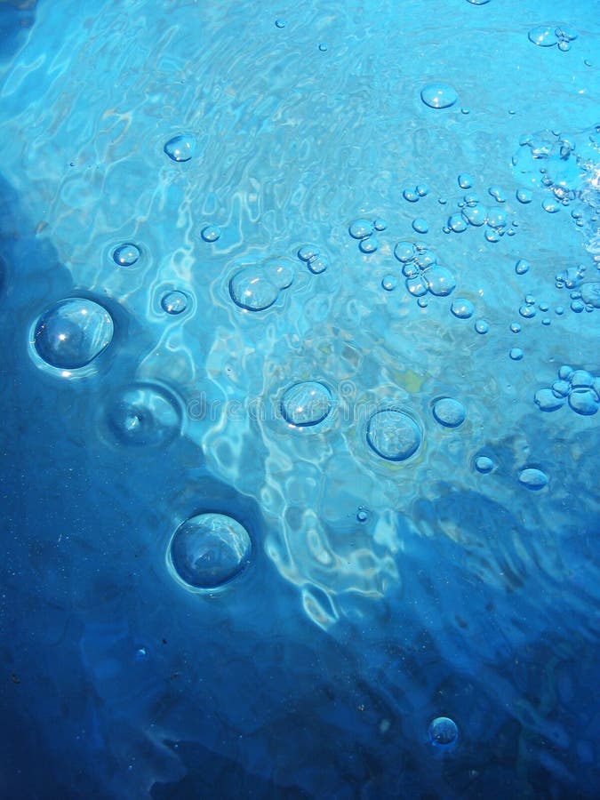 Bubbles on the water level stock photo. Image of surface - 5069902