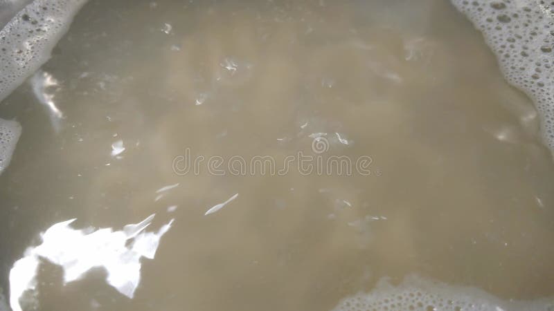 Bubbling Pasta in Boiling Water: Cooking Process Close-Up for Culinary Use Stock Footage - Video ...
