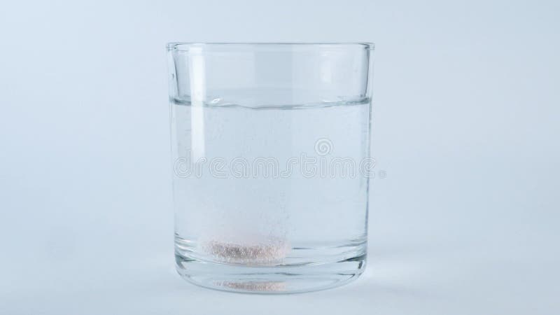 Bubbling Reaction in Clear Glass with Effervescent Tablet. Slow Motion ...